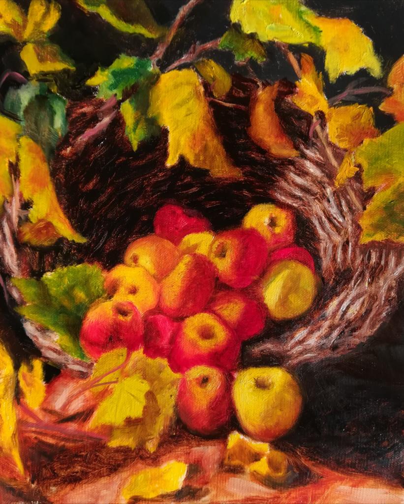 Painting study of a basket full of red and yellow apples